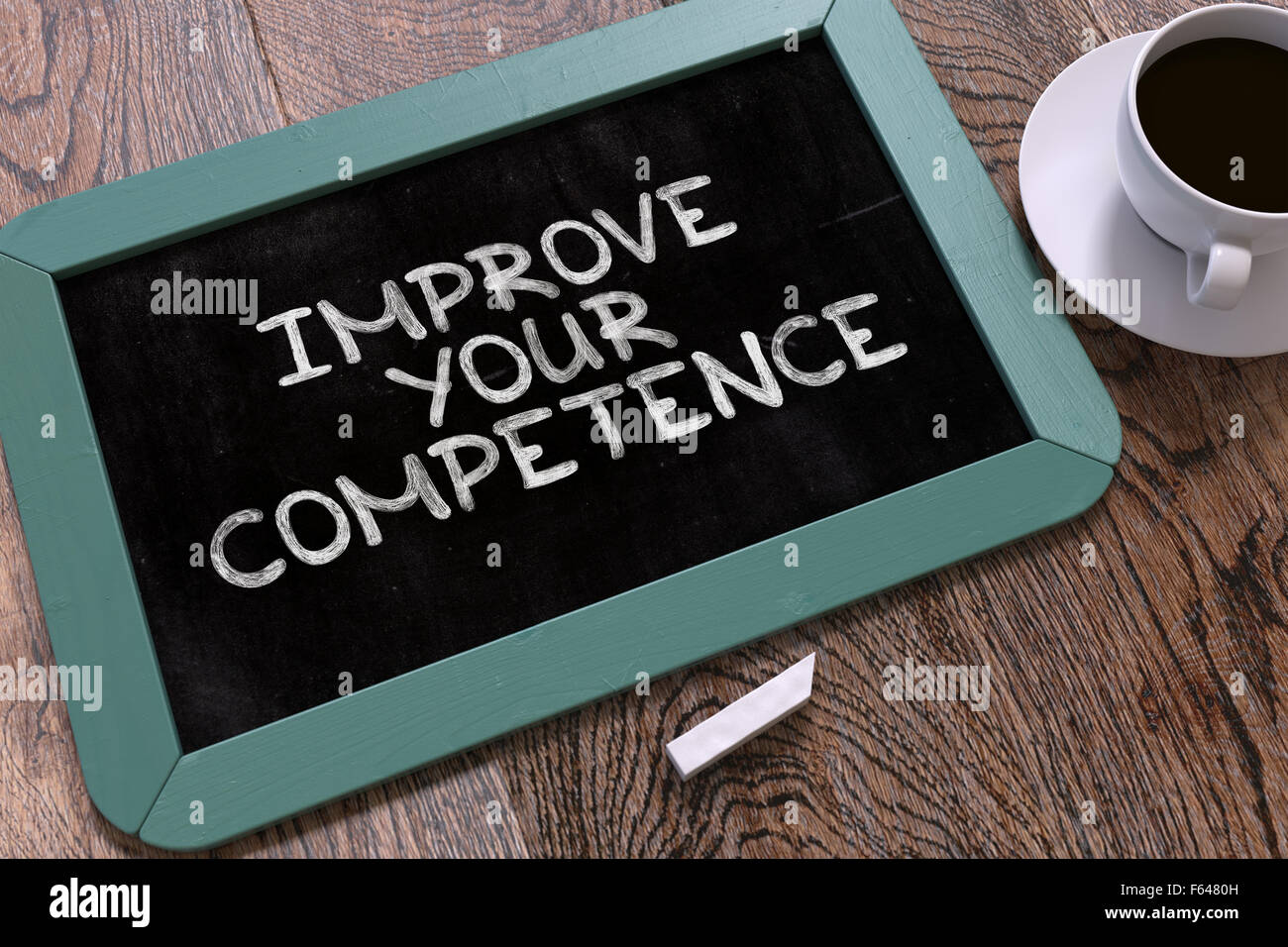 Handwritten Inspirational Quote - Improve Your Competence on a Blue ...