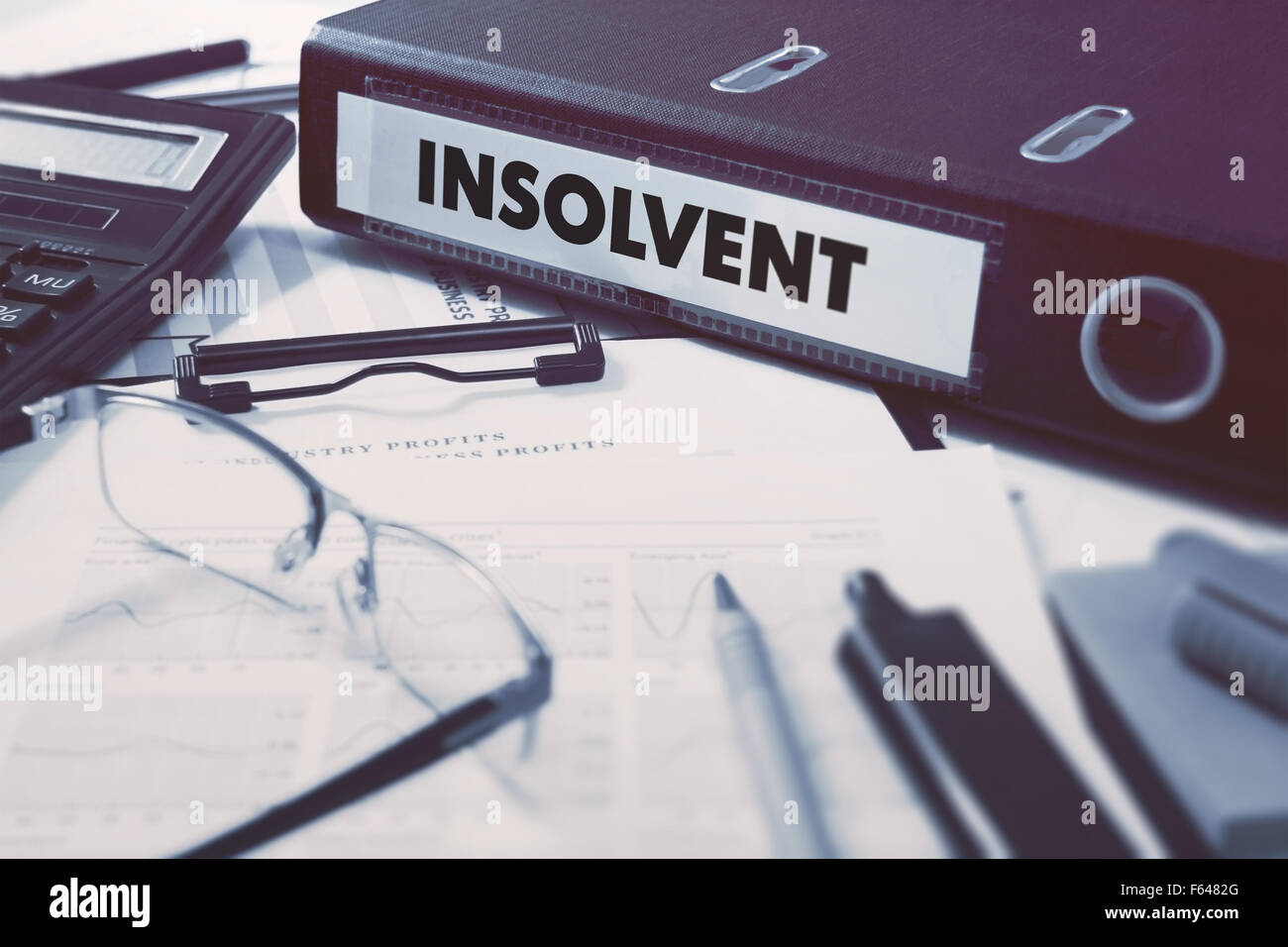 Office folder with inscription Insolvent on Office Desktop with Office ...