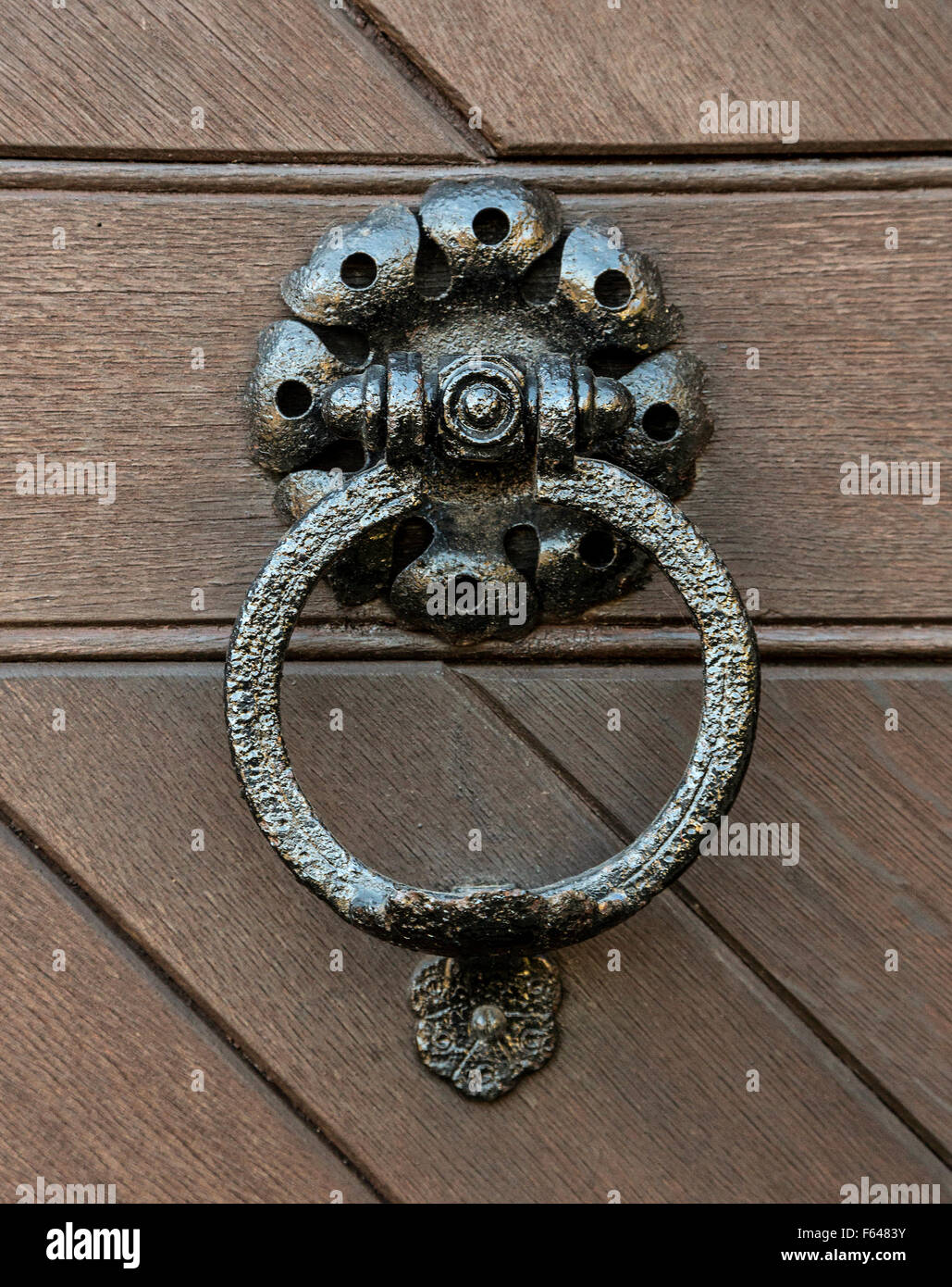 Knocker, hammered metal door knocker. The door to the vault in ...