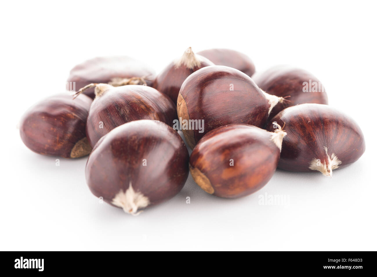 Chestnuts with shell isolated on white background Stock Photo - Alamy