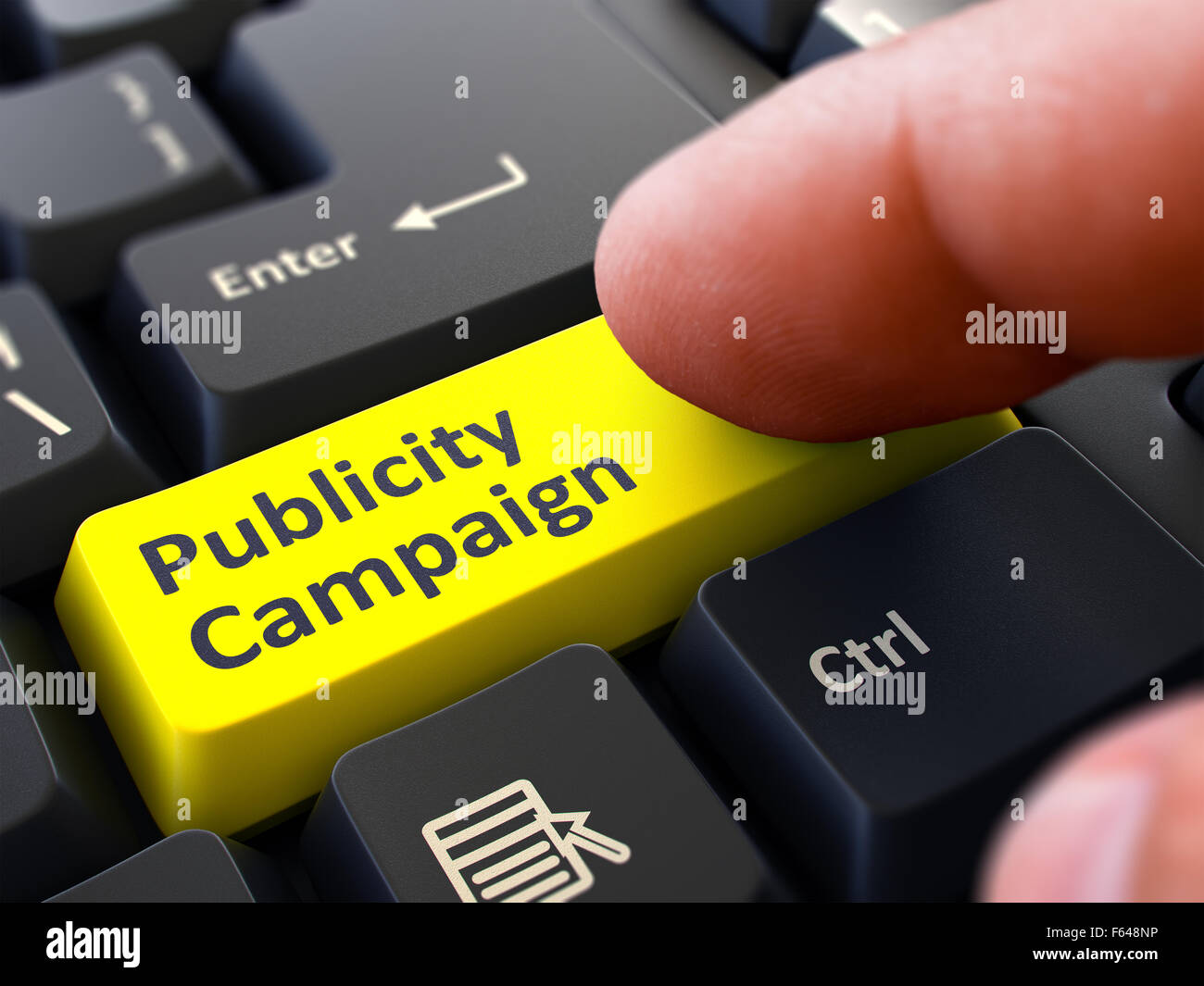 One Finger Presses Yellow Button Publicity Campaign on Black Computer ...