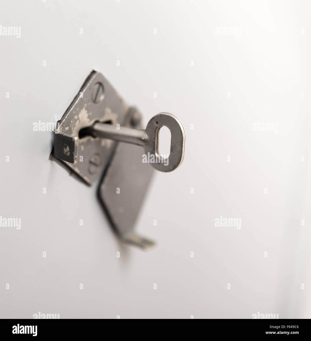 Old key in keyhole closeup Stock Photo - Alamy