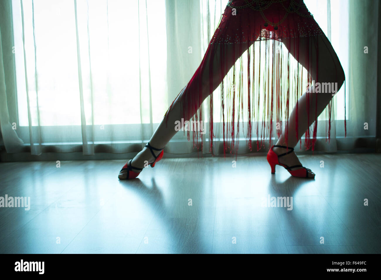Woman legs in dancing pose Stock Photo - Alamy