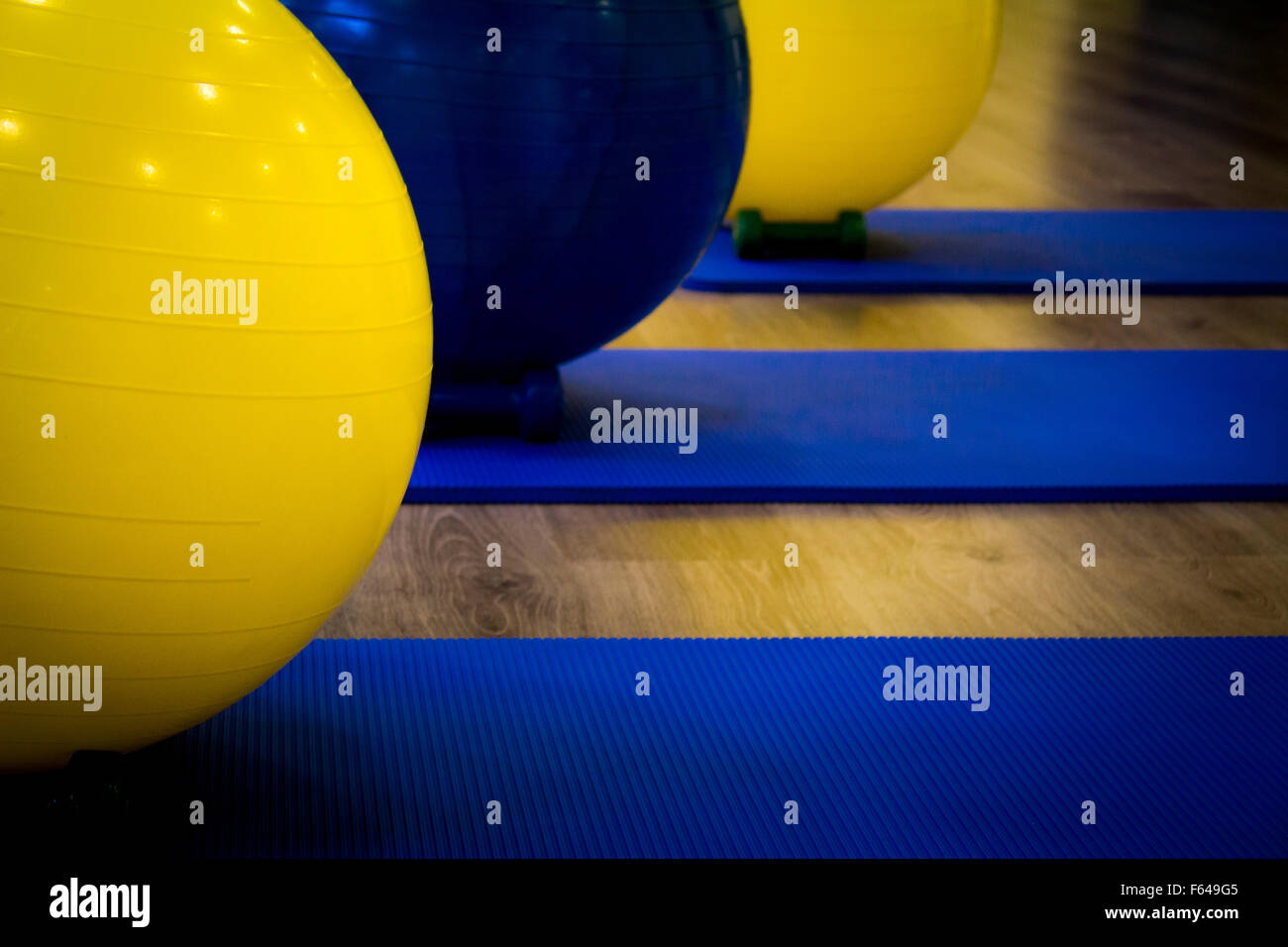 Fitness balls on yoga mat Stock Photo - Alamy