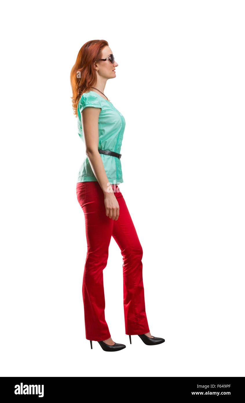 Portrait of a young woman standing over white Stock Photo - Alamy