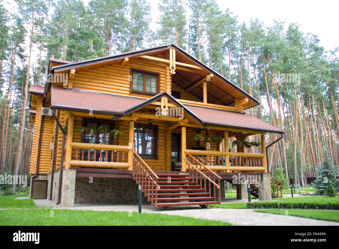 Wood mansion in pine forest Stock Photo - Alamy