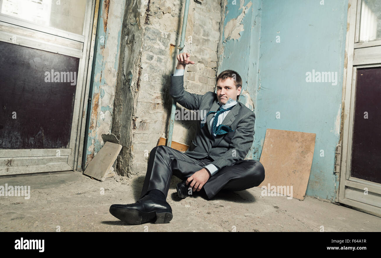 Captive man with handcuffed hand in old house Stock Photo - Alamy