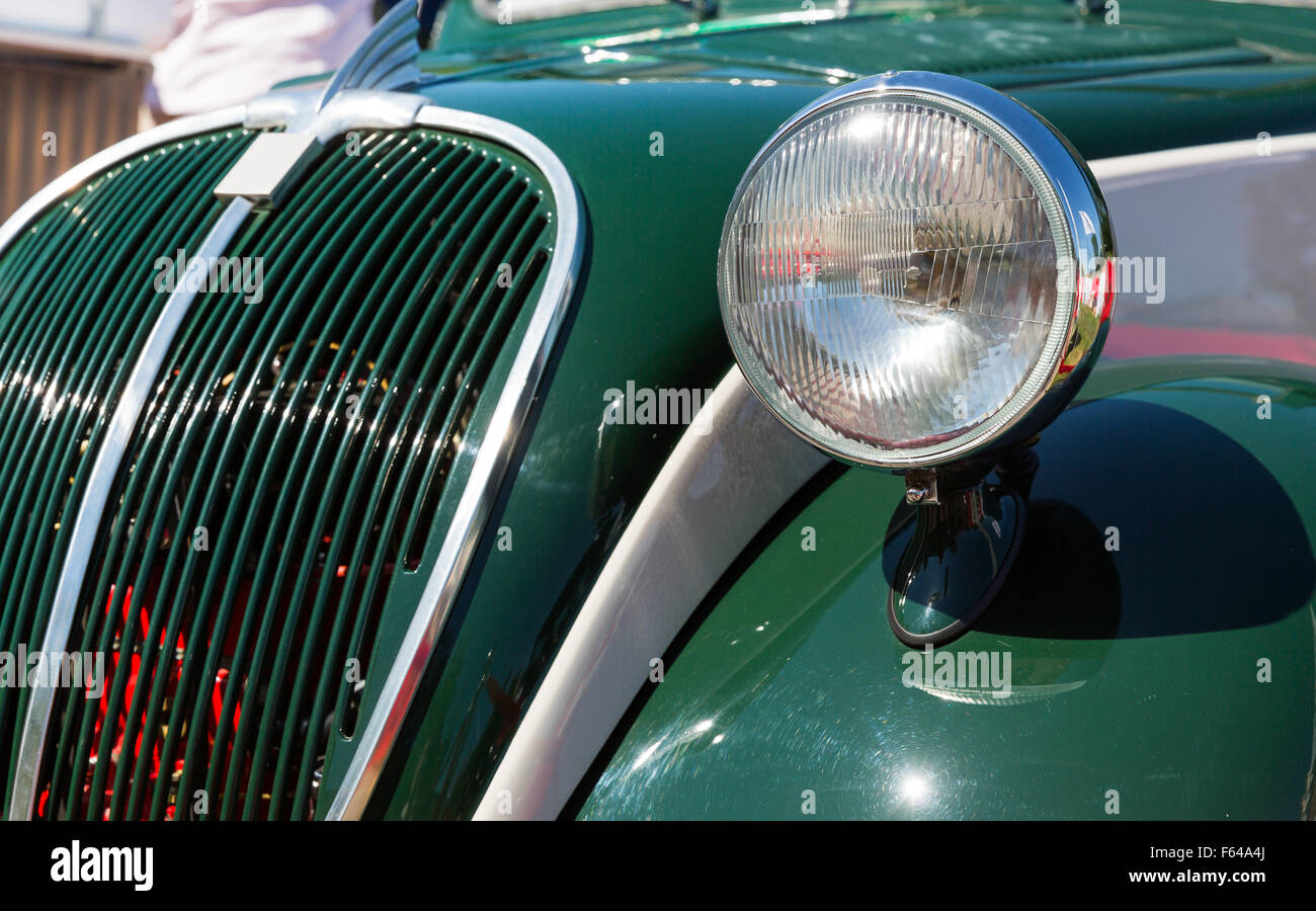 Close up of head-light of the retro green car Stock Photo - Alamy