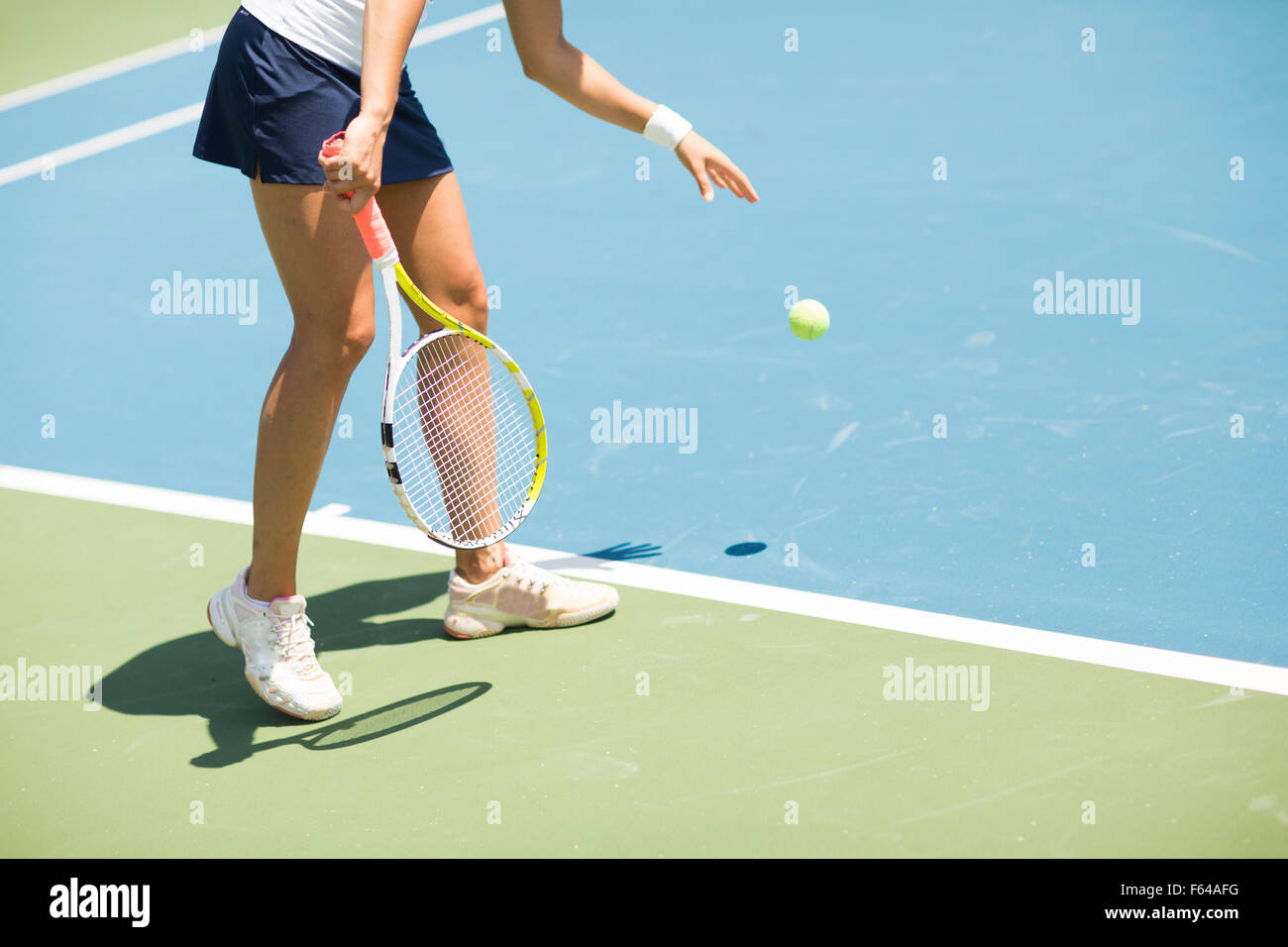 Woman playing tennis action hi-res stock photography and images - Alamy