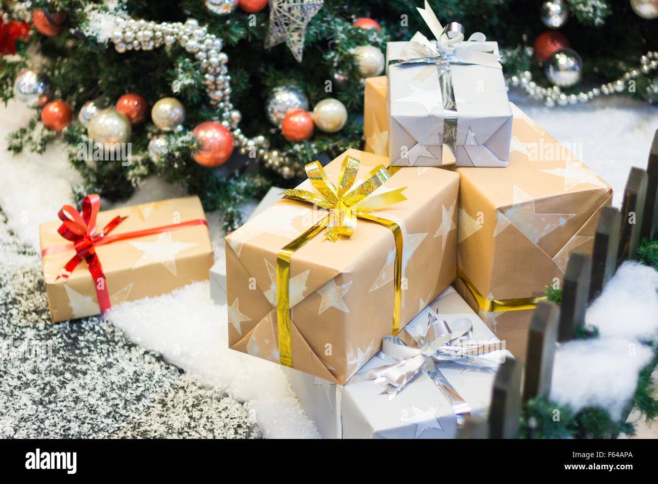 Presents wrapped and under a christmas tree hi-res stock photography ...