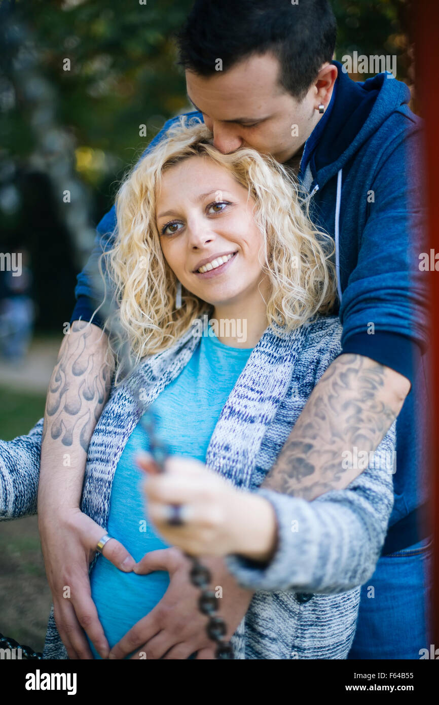 Young pregnant couple on the spring Stock Photo - Alamy