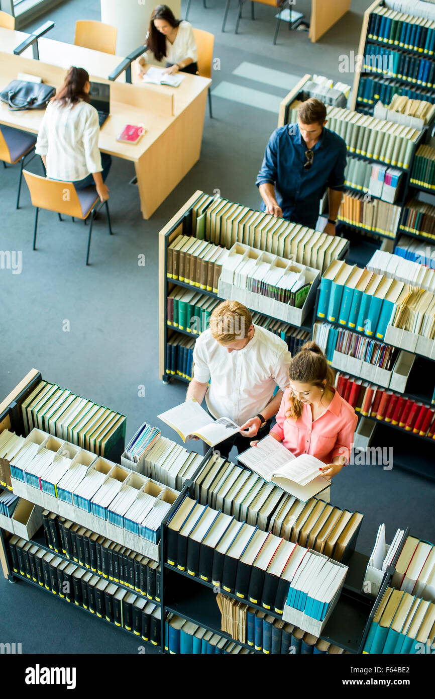 Young people in the library Stock Photo - Alamy