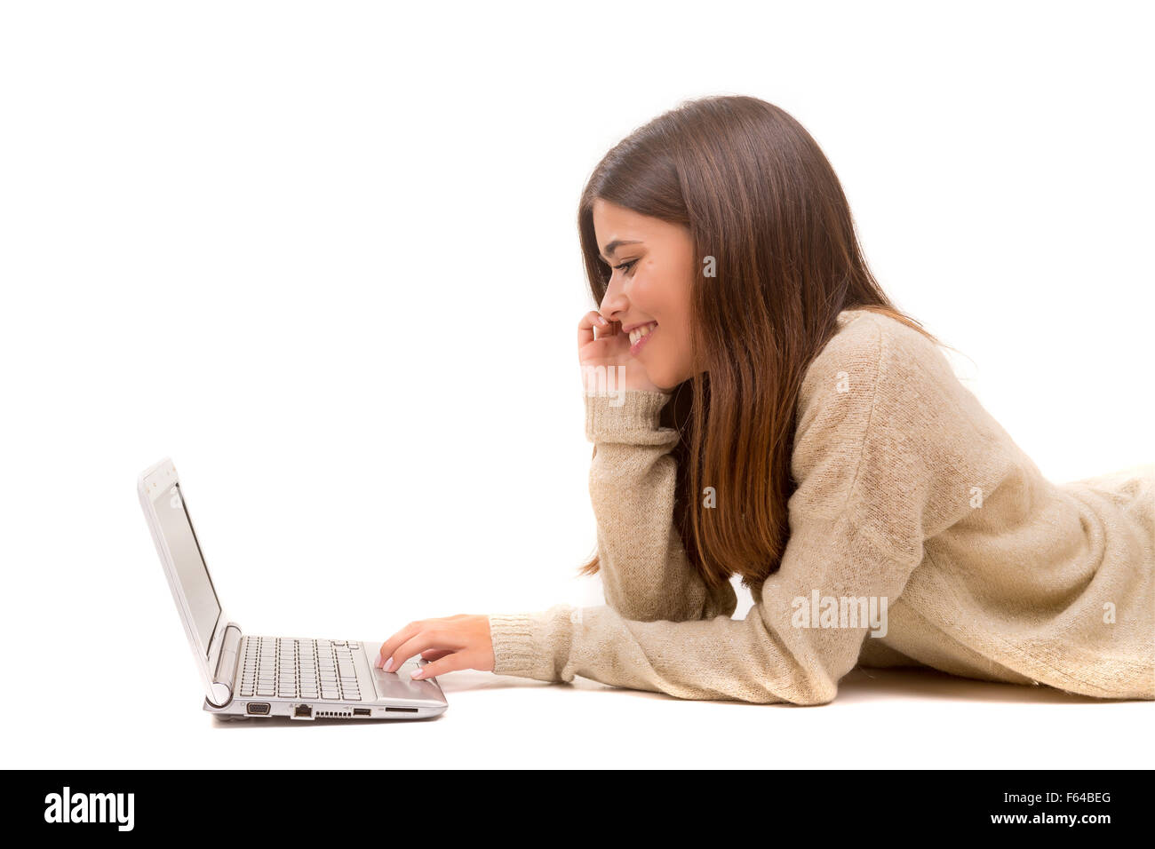 Young student working with her laptop, isolated over a white background ...