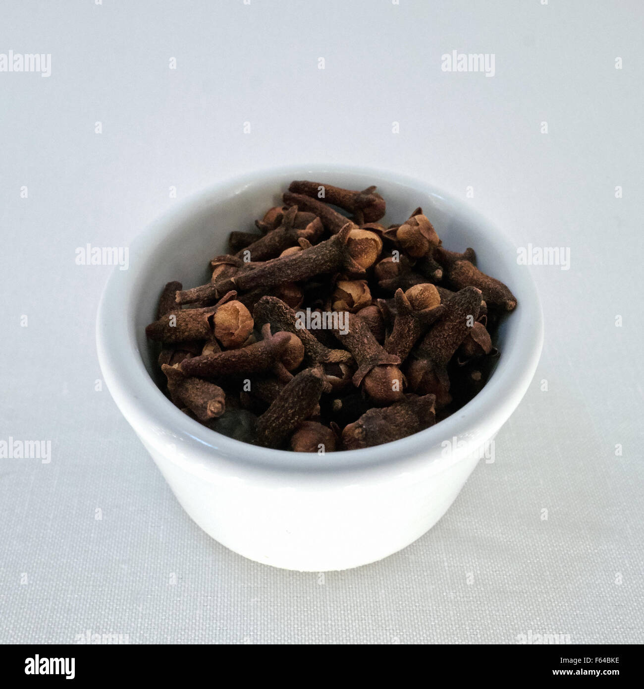 A pot of cloves, the aromatic flower buds of a tree in the family ...