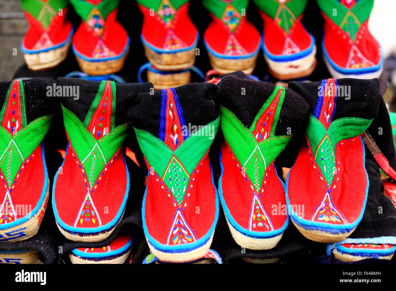 Many colored traditional tibetan fabric shoes for men. Stall of the ...