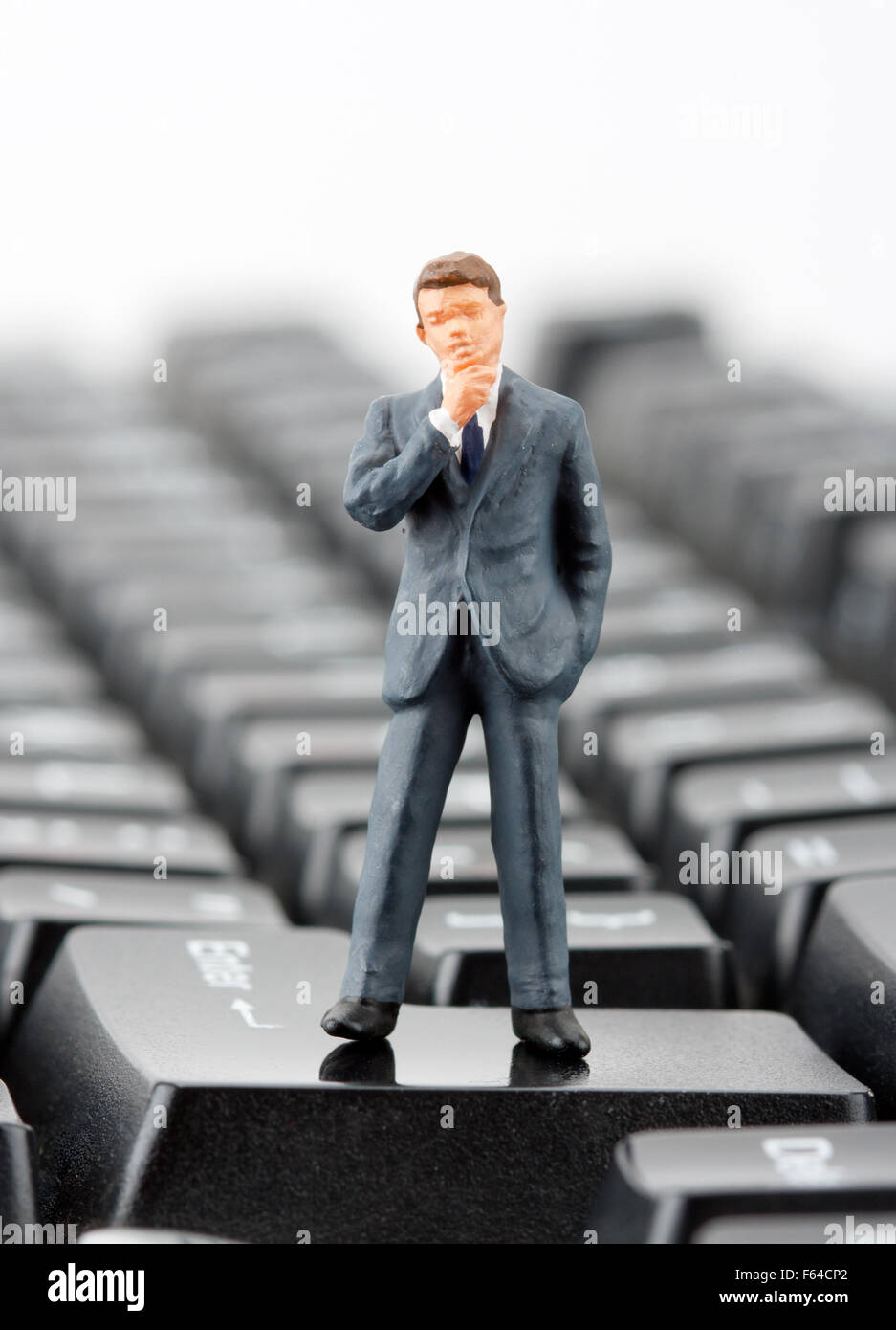 Miniature figurine thinking hi-res stock photography and images - Alamy
