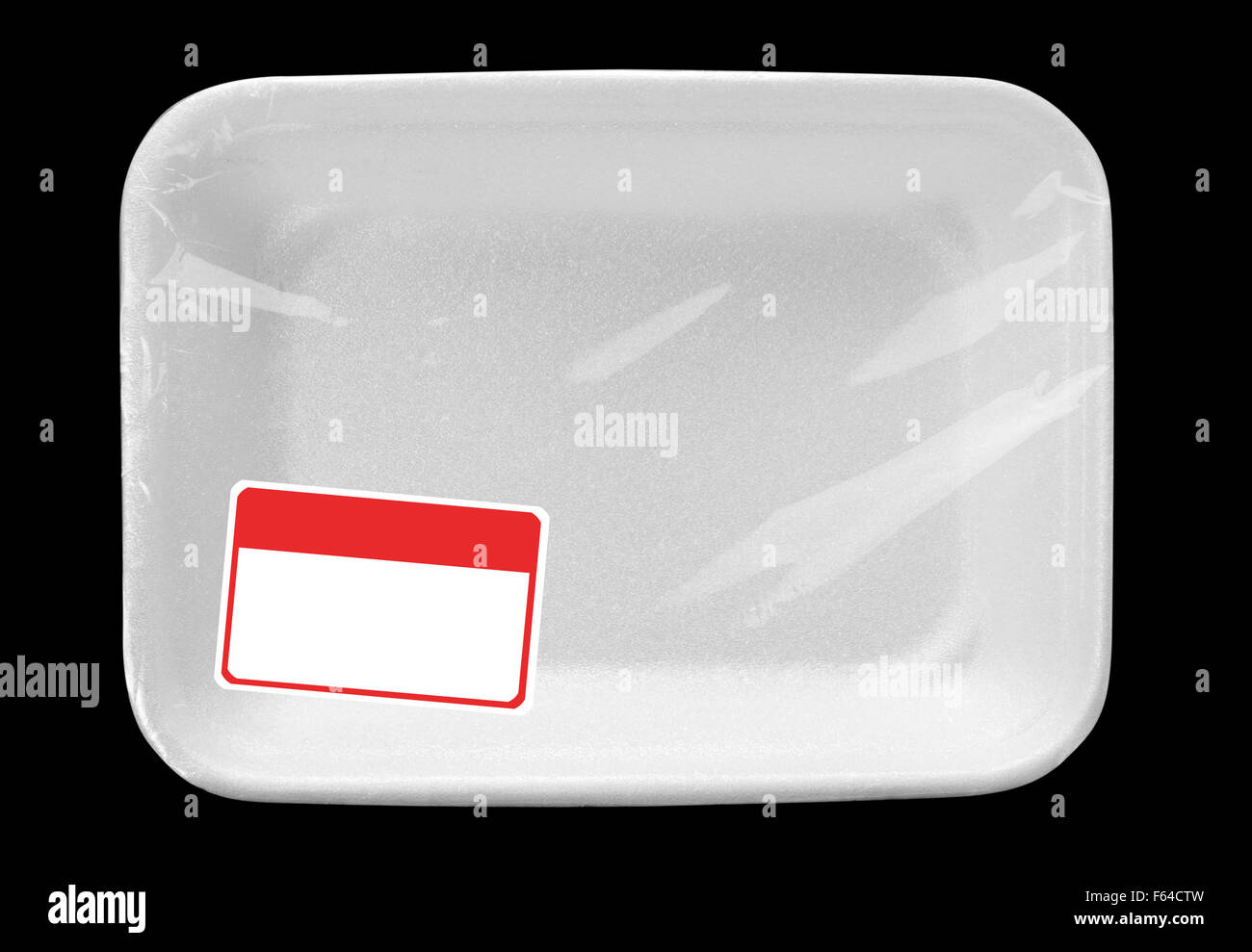 Empty wrapped white food tray with blank label. Isolated on black Stock ...