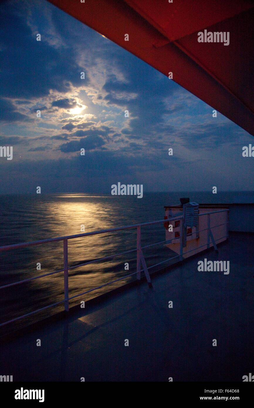 on a Laker Ship on the Great Lakes at night moon and clouds Stock Photo ...