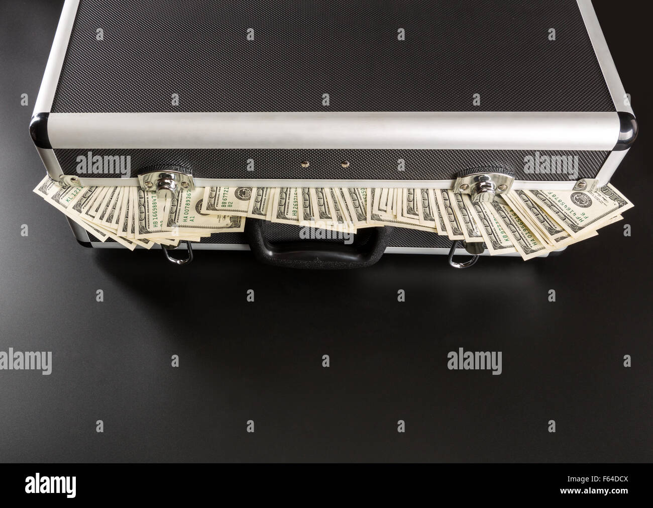 Case with dollars inside isolated on gray background Stock Photo - Alamy