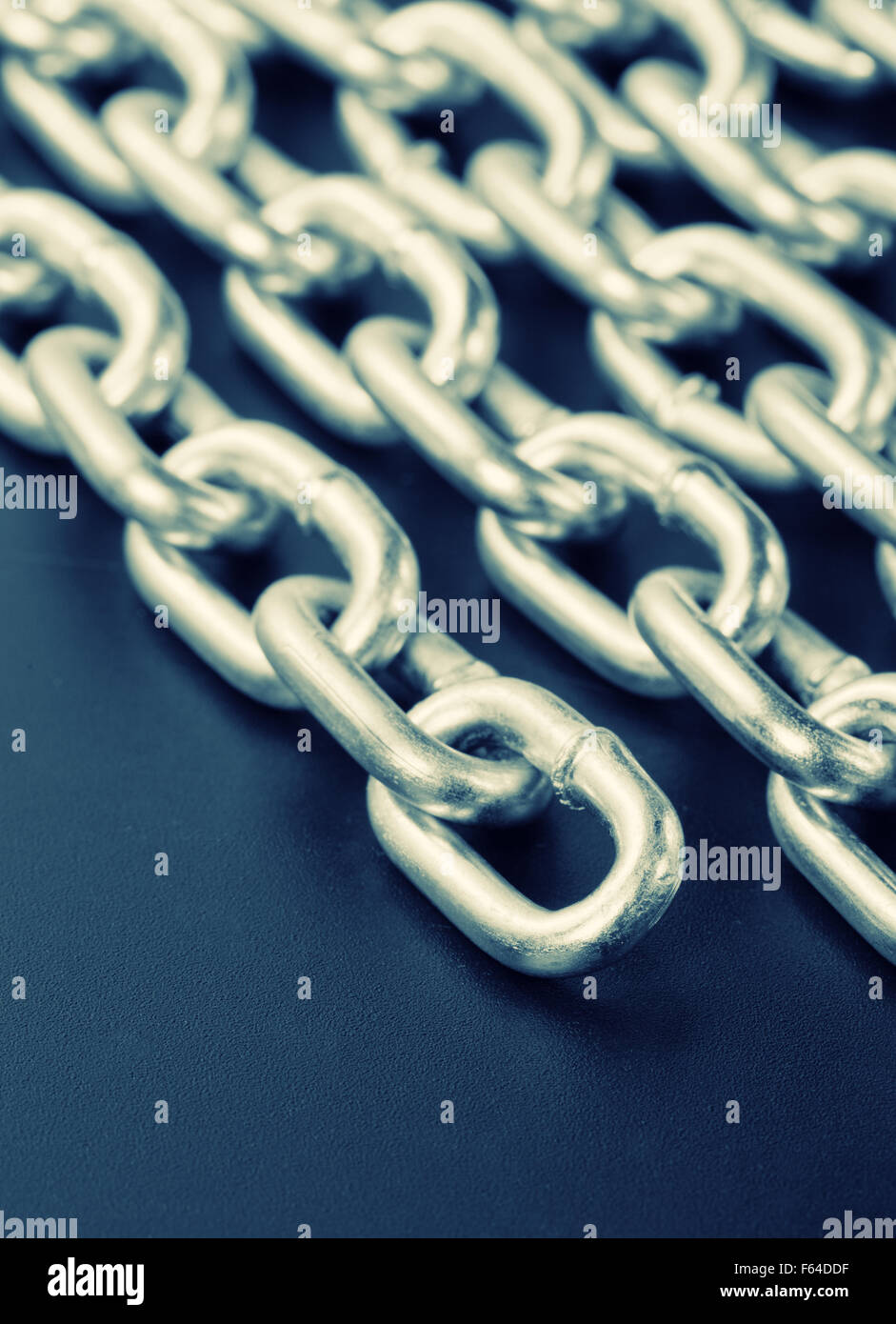 Closeup of industrial chains. Toned Stock Photo - Alamy