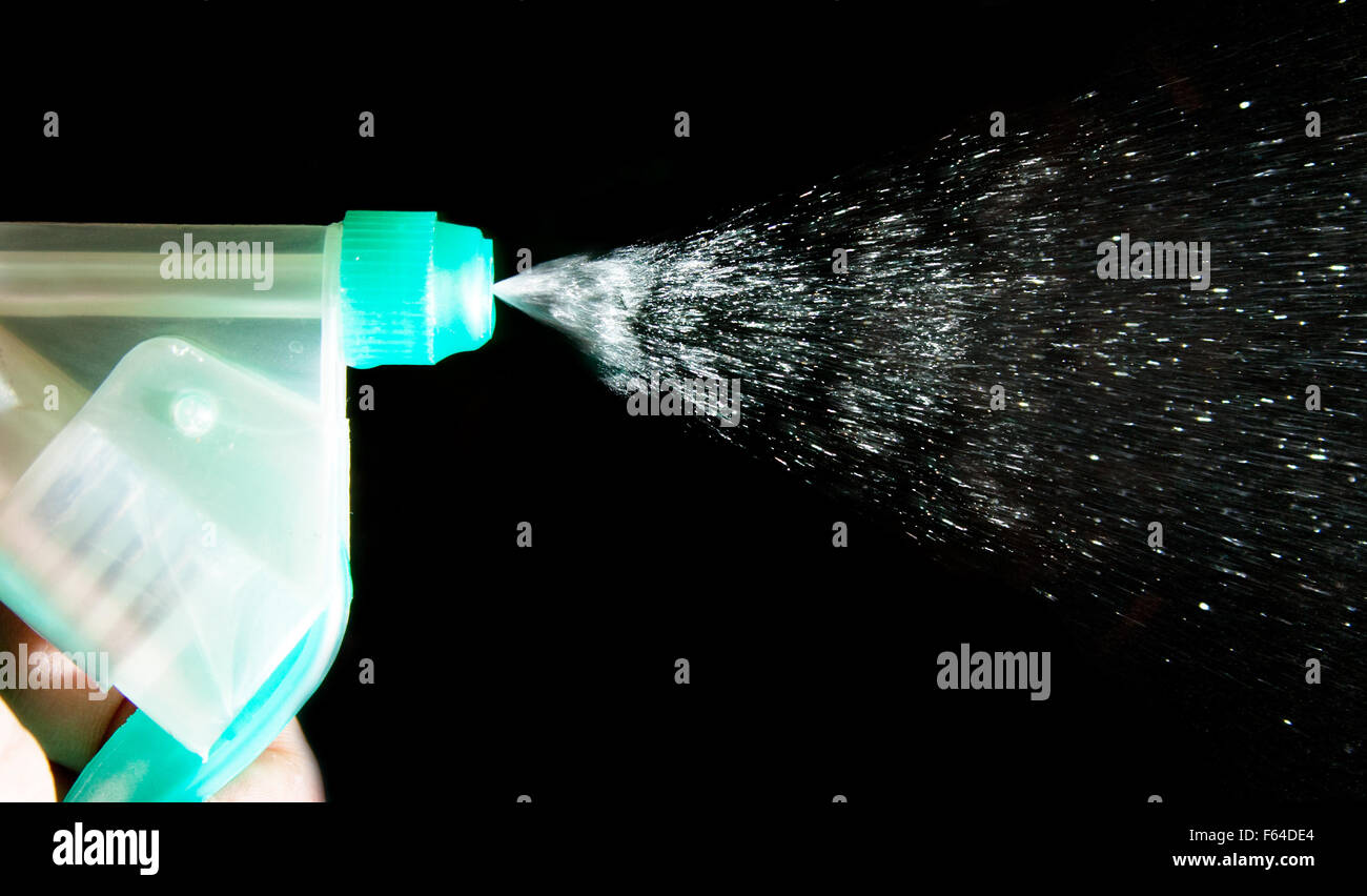 Close-up of splashing plastic water spray bottle Stock Photo - Alamy