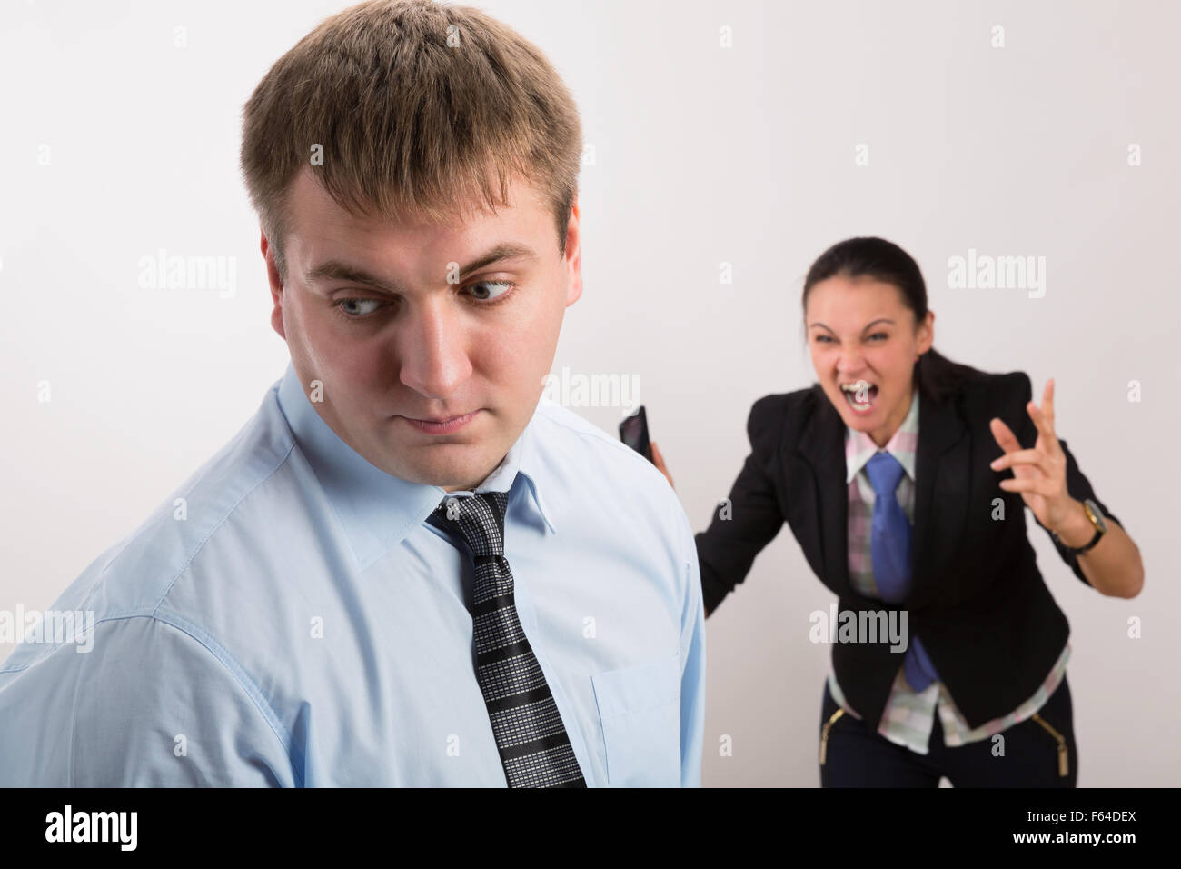 Two young caucasian office worker get mad Stock Photo - Alamy
