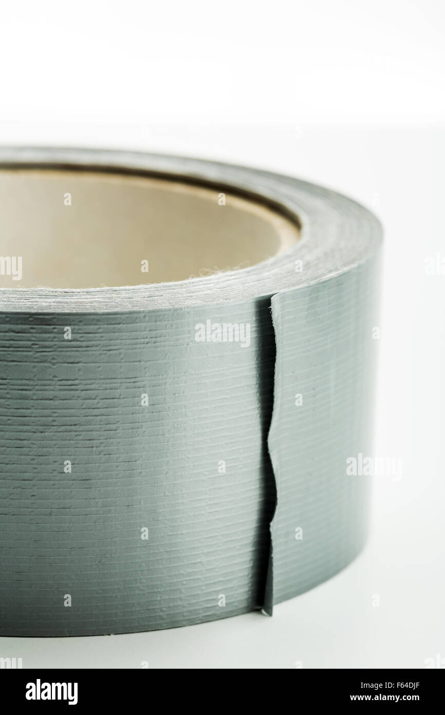 Closeup of a roll of silver adhesive tape on white background Stock ...