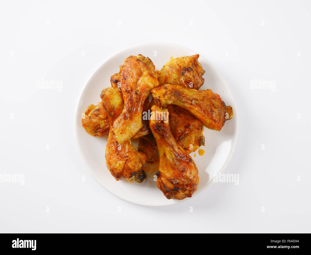 freshly roasted chicken legs on white plate Stock Photo - Alamy