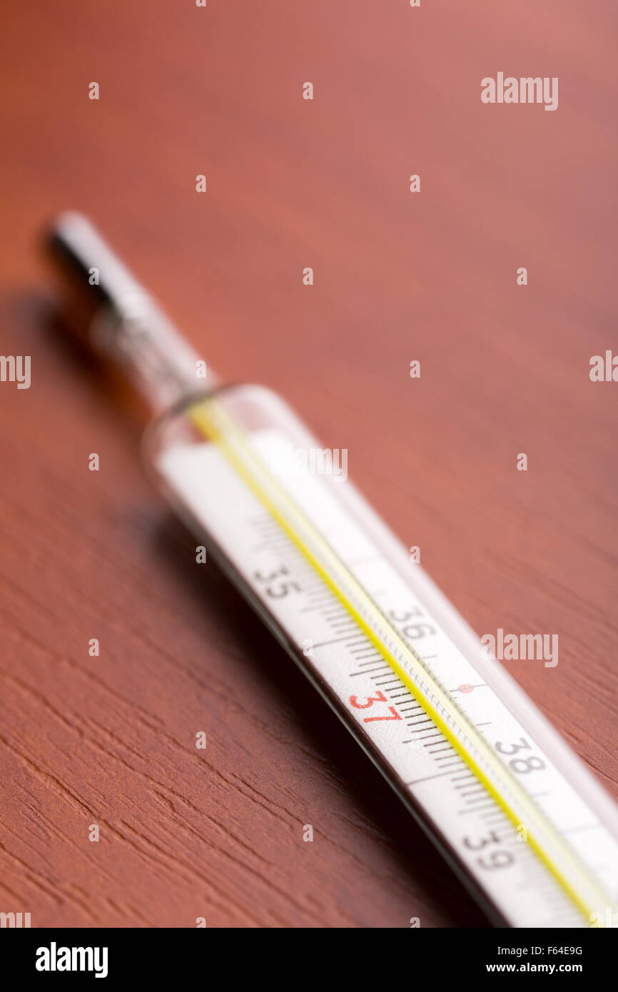 Closeup of thermometer on a wooden table Stock Photo - Alamy