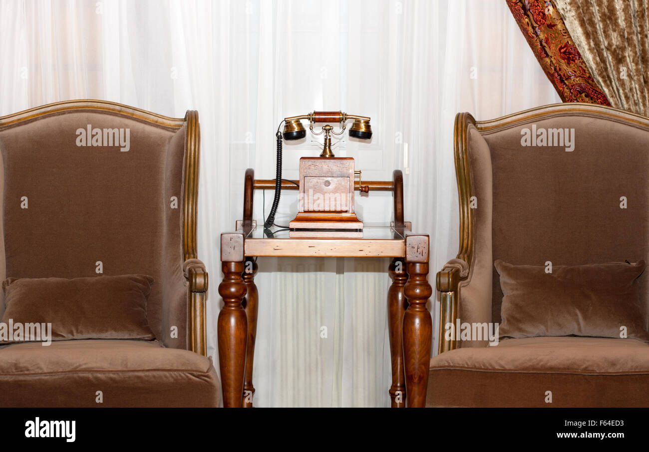 Vintage interior - telephone and armchairs Stock Photo - Alamy