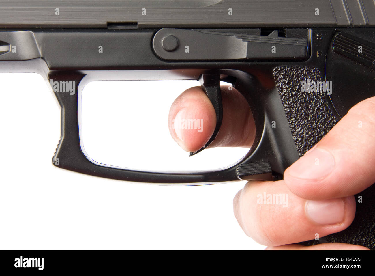 Pushing the handgun trigger Stock Photo - Alamy