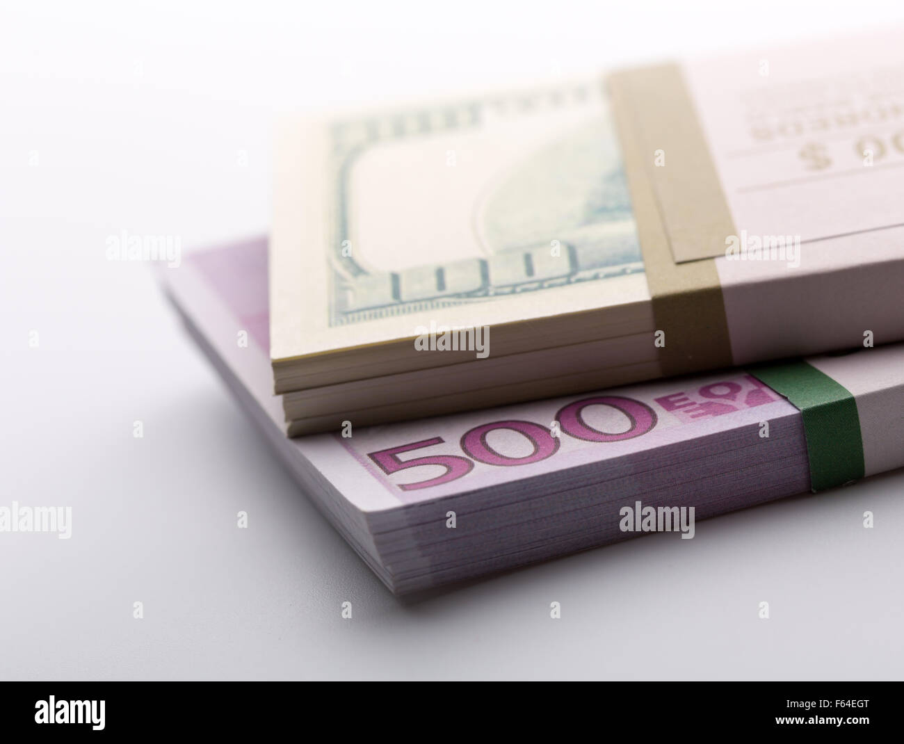 Packs of dollars and euros closeup Stock Photo - Alamy
