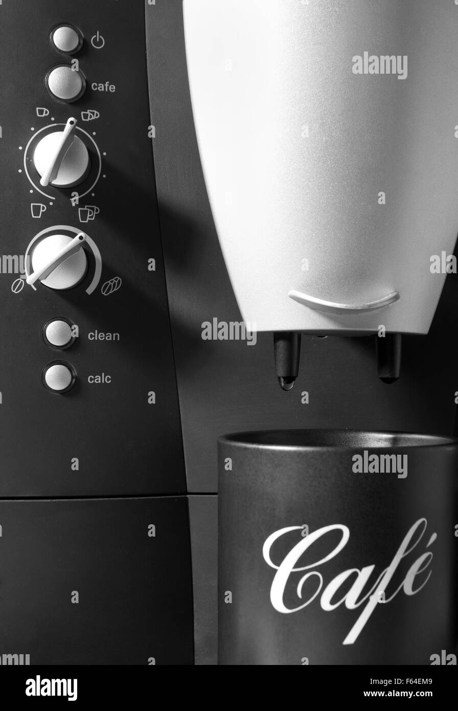 Front view of coffee machine with black cup Stock Photo - Alamy