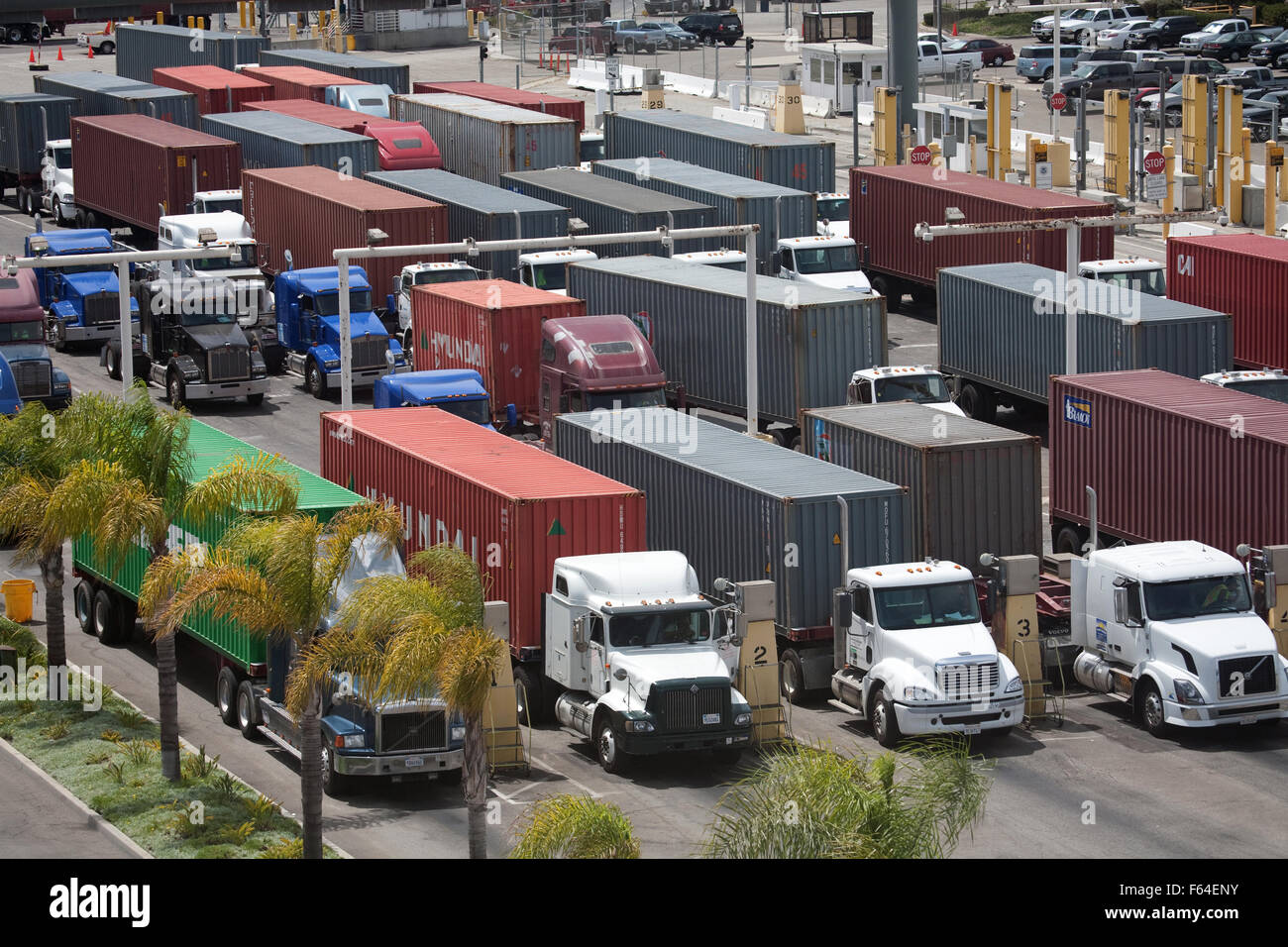 trucks lined up at port entry gate Stock Photo - Alamy