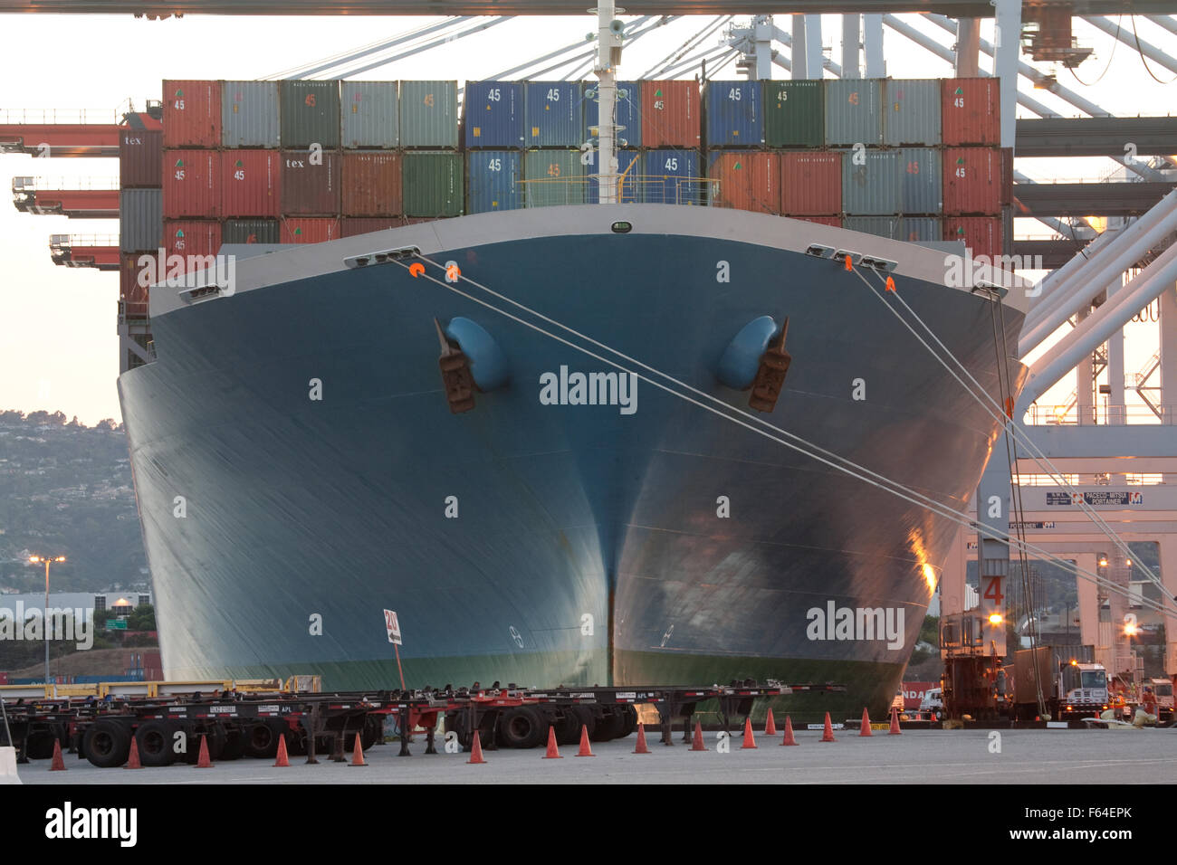 container ship loading at port facility at twilight night Stock Photo ...