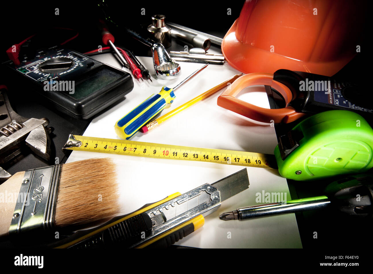 Heap of tools. Multimeter, spanner, wrench, helmet and other Stock ...