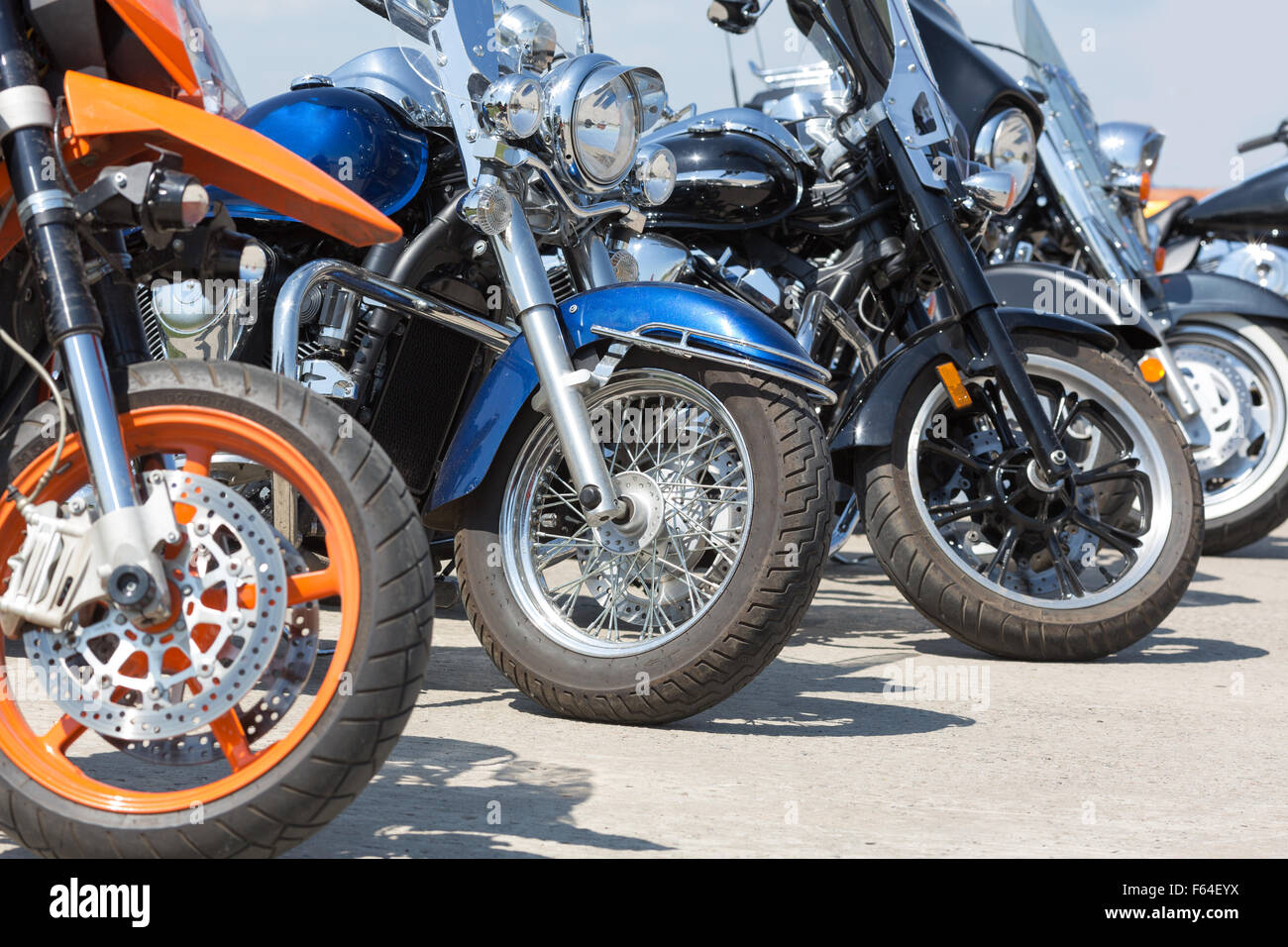 Row of few colorful motorcycles Stock Photo - Alamy