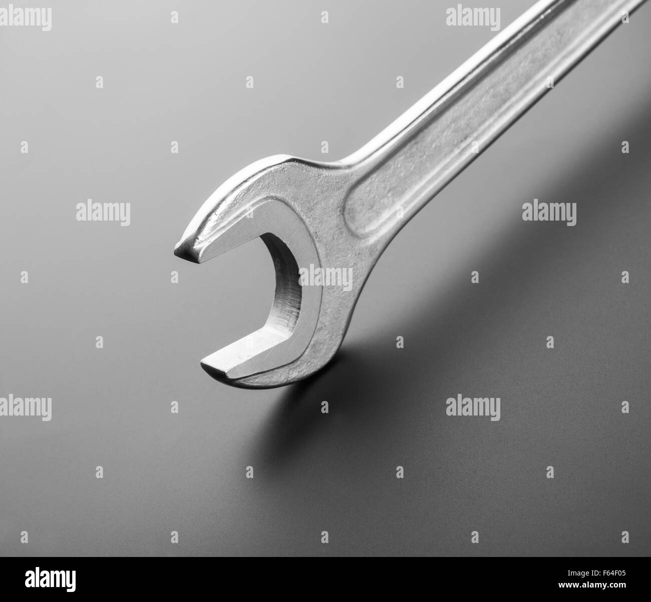 Stainless steel spanner on dark background Stock Photo - Alamy