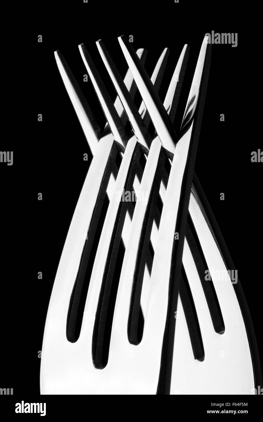 Two crossed silver forks. In B/W Stock Photo - Alamy