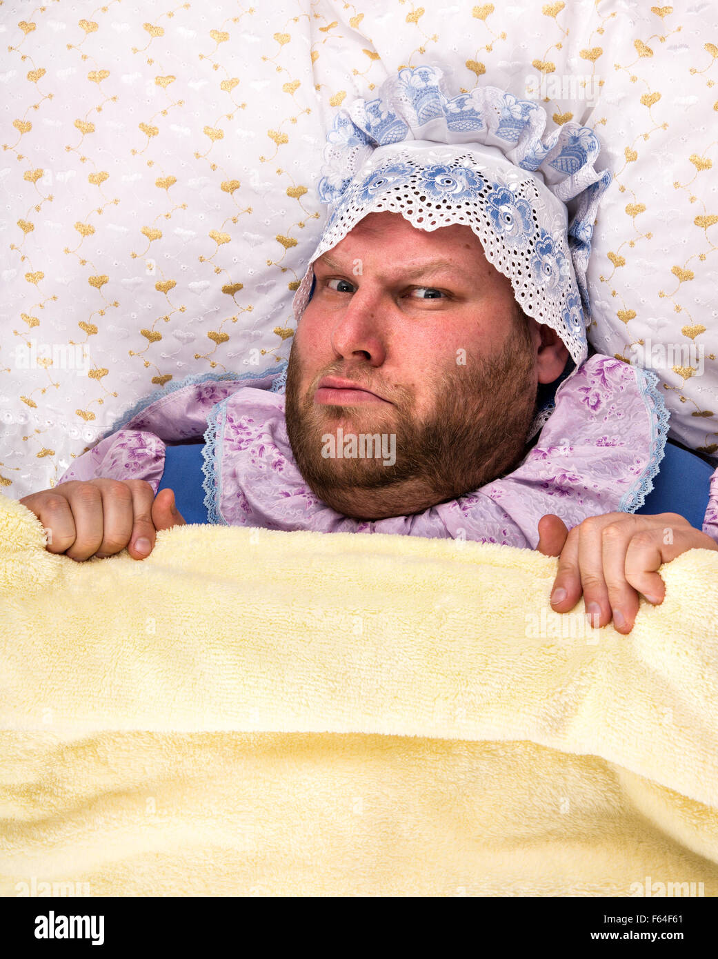 Man weared as baby looking at camera very angry Stock Photo - Alamy
