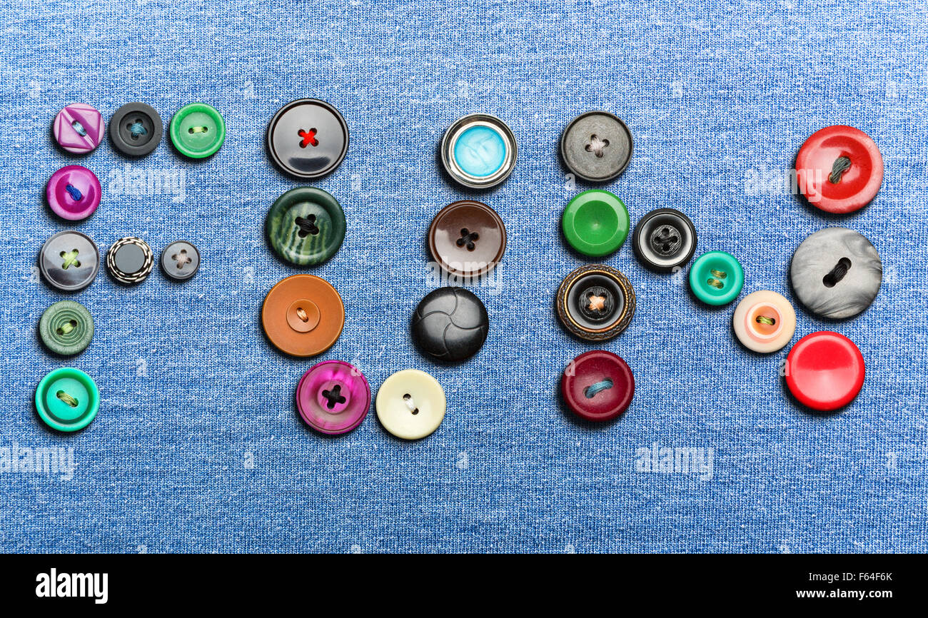 Colorful buttons on blue background forming the word 'fun' Stock Photo ...