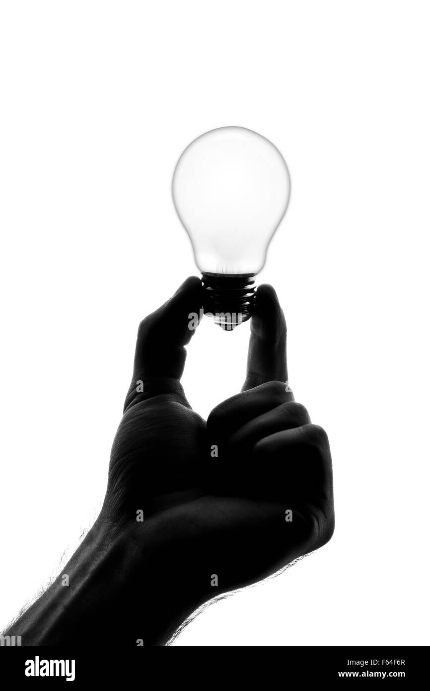 Silhouette of hand holding dull bulb. Isolated on white Stock Photo - Alamy