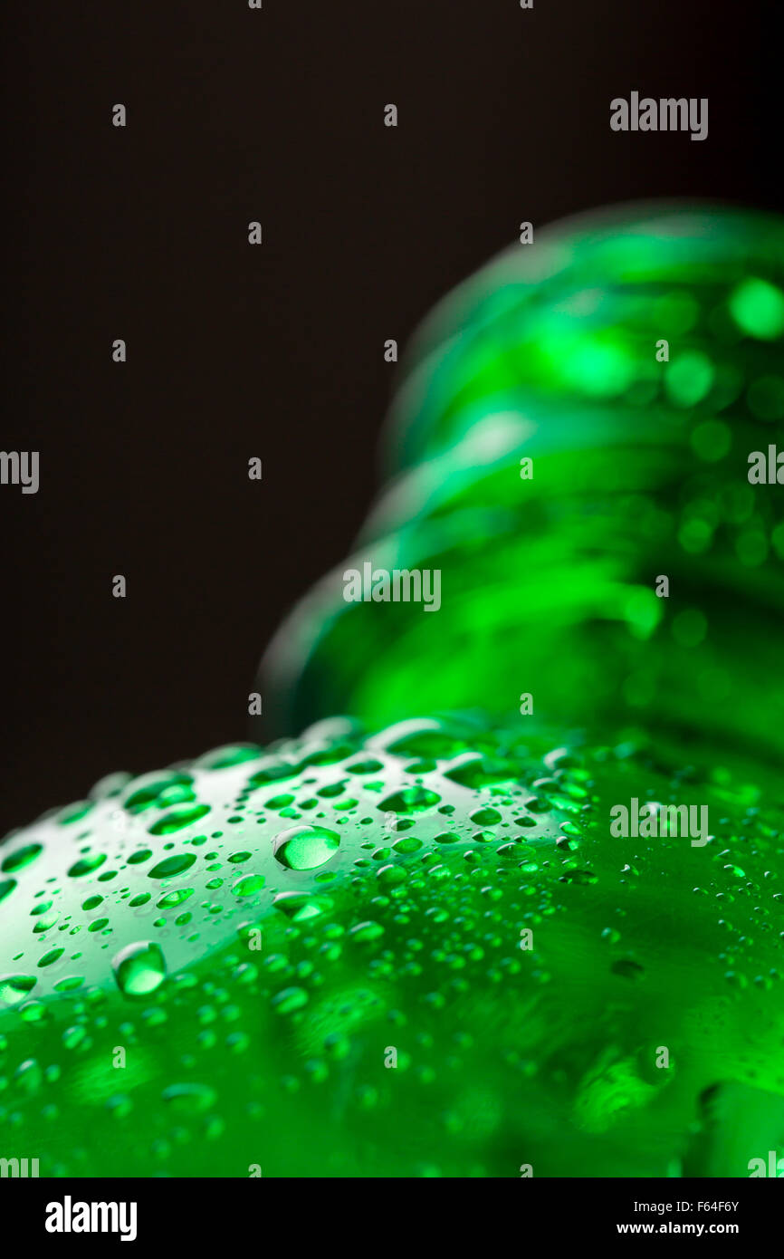 Drops on green water bottle closeup Stock Photo - Alamy