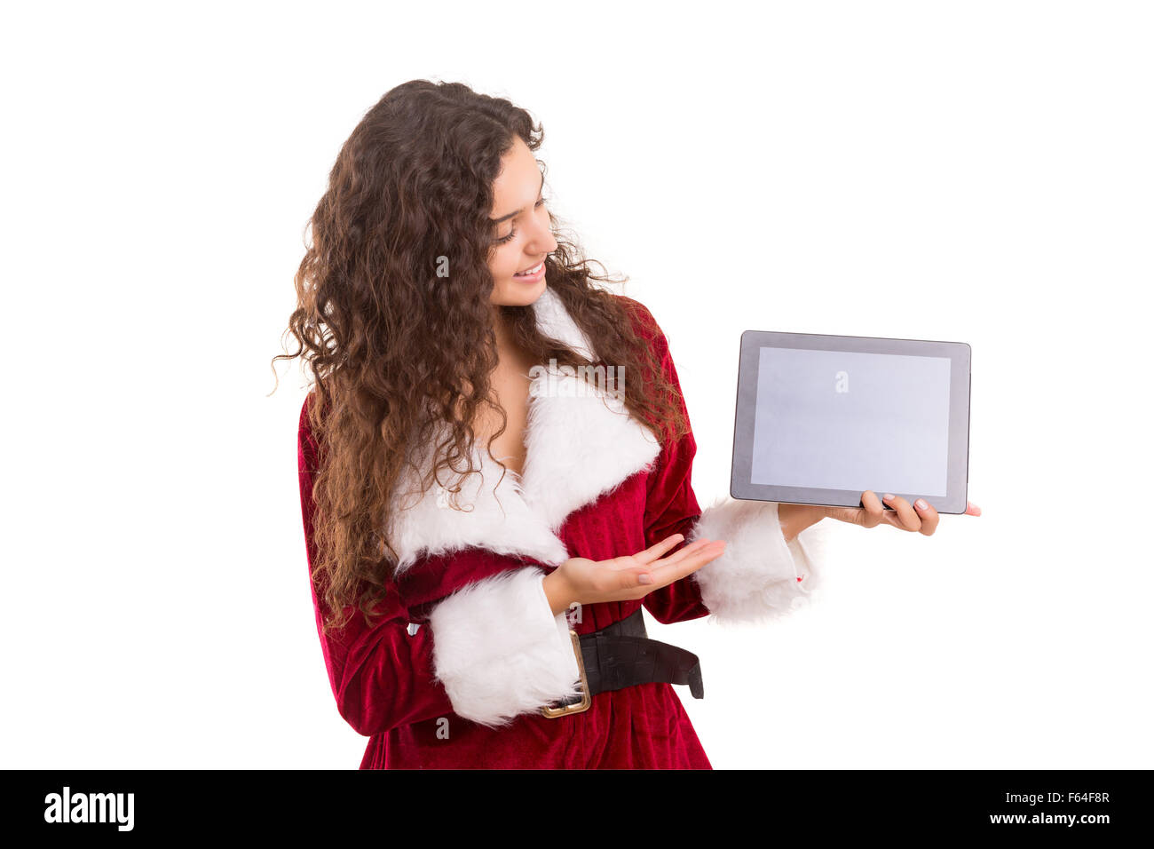 Young woman dress in Christmas costume, presenting your product on a ...