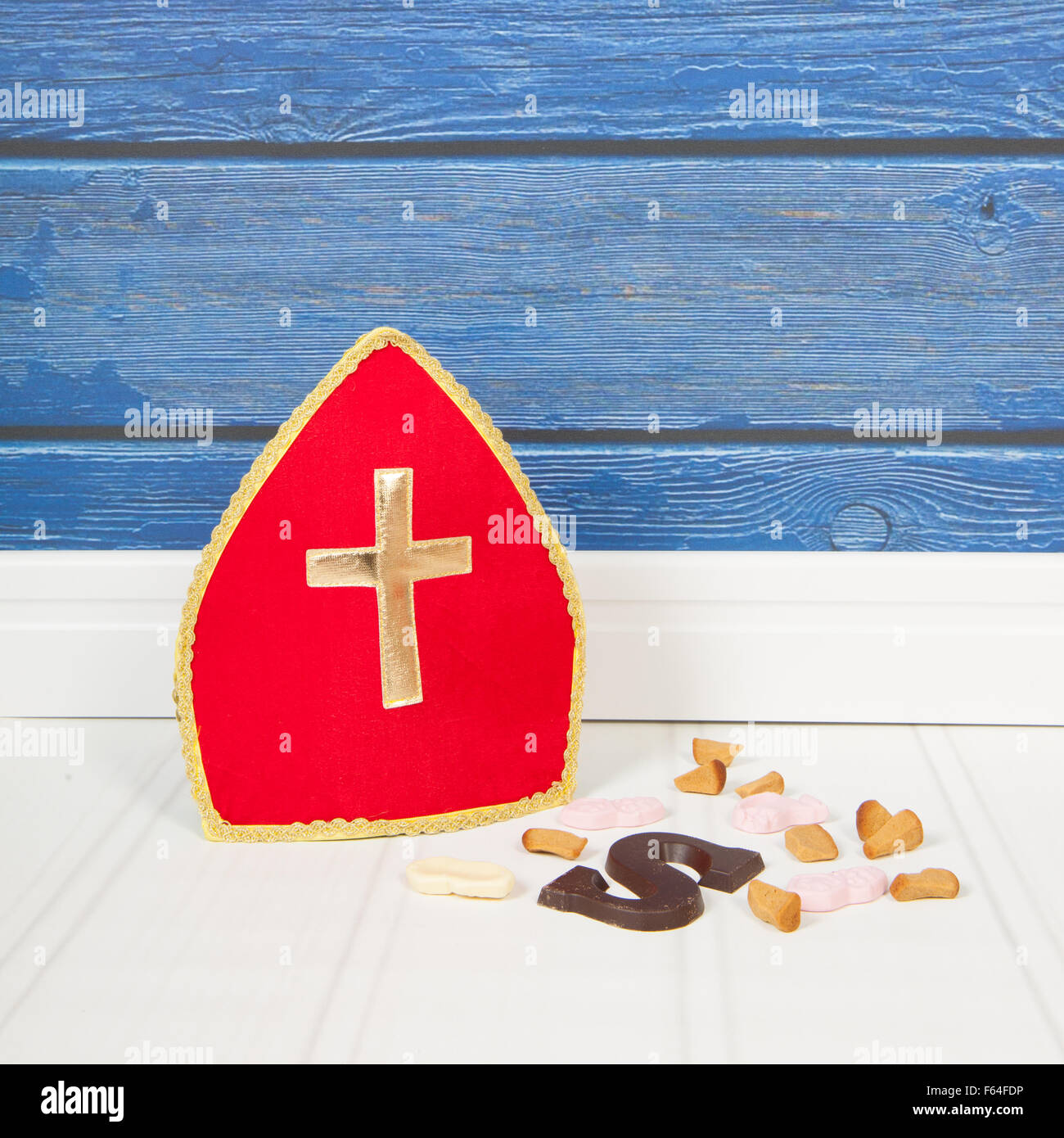 Dutch Sinterklaas candy and mitre on blue background Stock Photo - Alamy