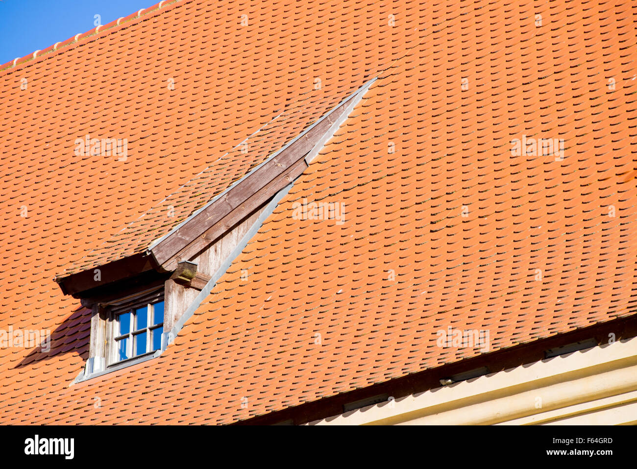 Red Tile. Window on the roof Stock Photo - Alamy