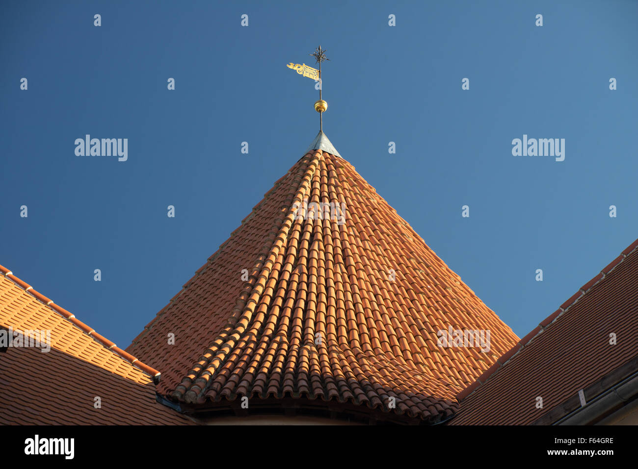 Red Tile. Spire on the roof Stock Photo - Alamy