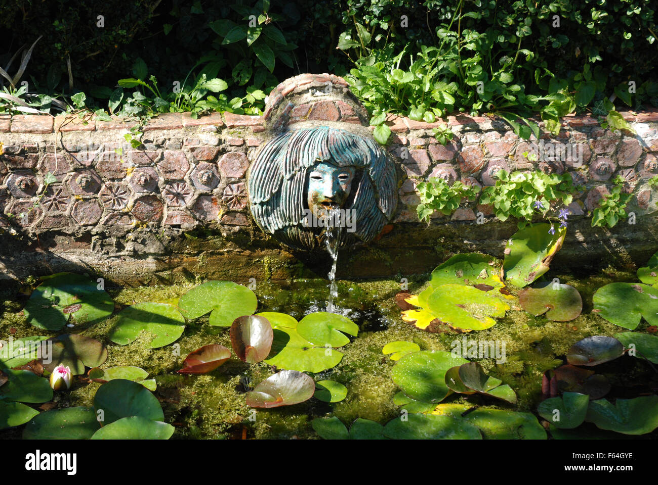 gargoyle type water feature Charleston farmhouse Stock Photo - Alamy
