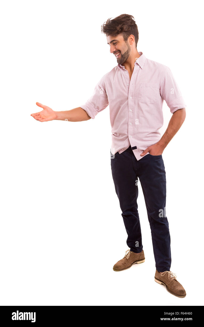 Young man presenting your product, isolated over a white background ...