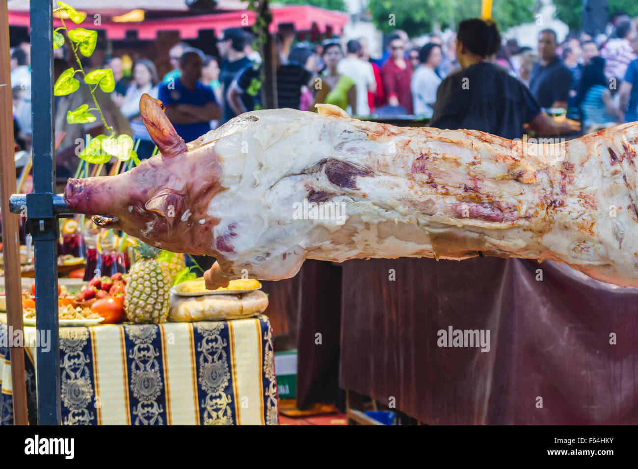 huge grilled pork fact, medieval fair in Spain Stock Photo - Alamy